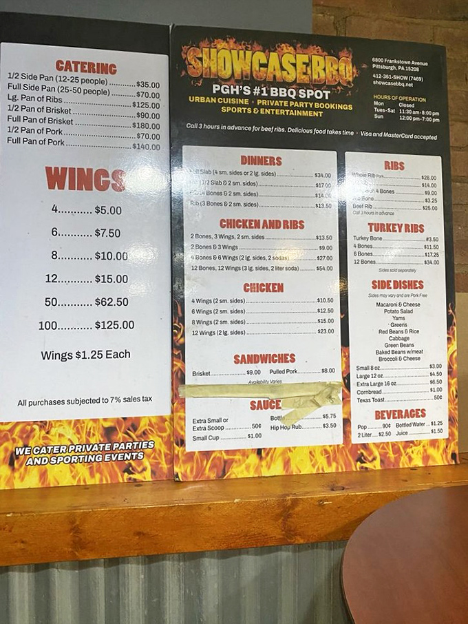 The menu board at Showcase BBQ reads like a love letter to smoked meat enthusiasts, with those legendary turkey ribs stealing the spotlight.