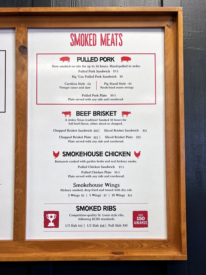 The menu board tells the story: 14-hour smoked pork, 10-hour brisket, and over 150 awards. Some reading materials are worth savoring.