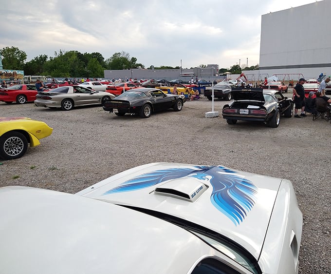 Classic American muscle meets modern cinema. Car enthusiasts gather for special events, turning the lot into an impromptu auto show before showtime.