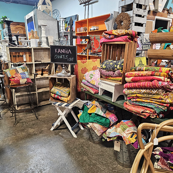 Kantha quilts stacked like colorful chapters of a global story. Each one handmade, each one carrying memories from another life.