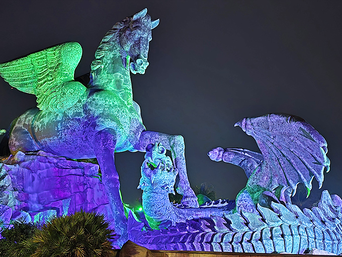 By night, the statue transforms into a technicolor dream, illuminated in hues that would make even Las Vegas blush.