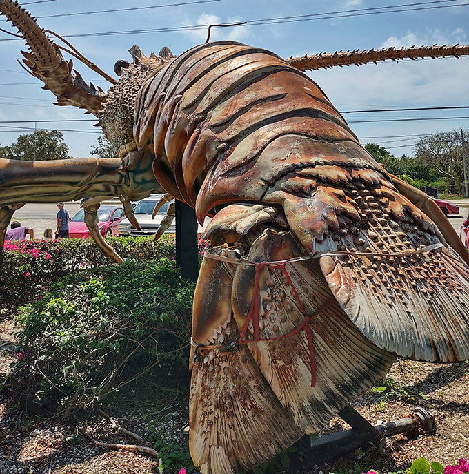 The intricate tail section reveals the sculptor's attention to detail, with every ridge and segment meticulously crafted to anatomical perfection.