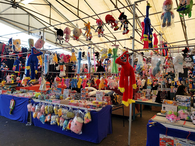 Plush paradise! These dangling stuffed companions are just waiting to be adopted and taken home&mdash;childhood nostalgia suspended from the ceiling.