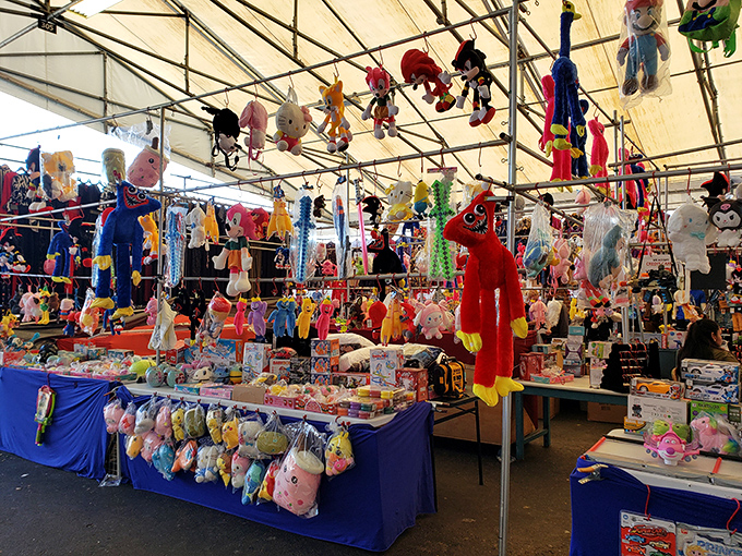 A plush paradise where stuffed animals dangle like colorful fruit, ready to be plucked by delighted children or nostalgic adults.