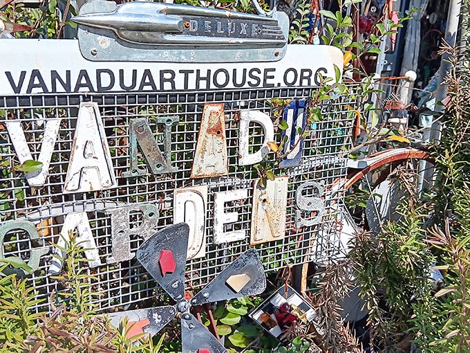 Even the website sign refuses conformity, with letters cobbled from car parts&mdash;the internet address that's also an art installation.