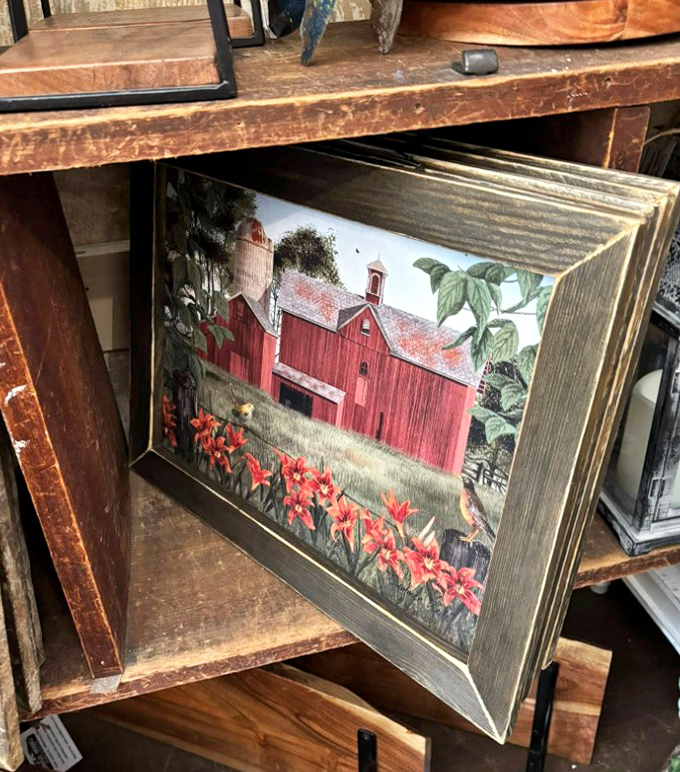 Billy Jacobs' iconic red barn print, framed in weathered wood, captures the essence of rural Ohio that makes you nostalgic for places you've never even been.