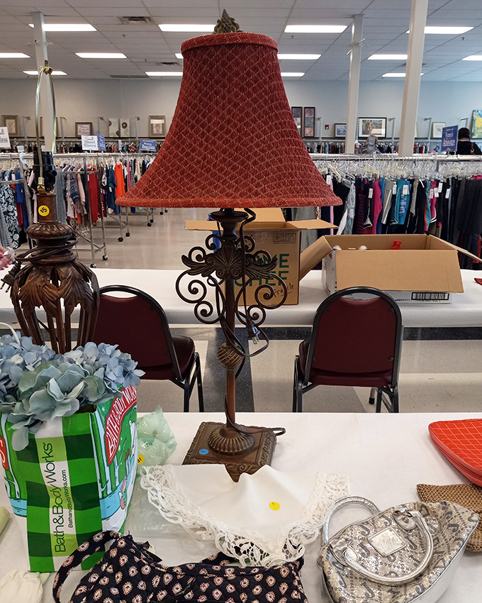 Not just a lamp, but someone's former conversation piece now awaiting adoption. That red shade has stories to tell!