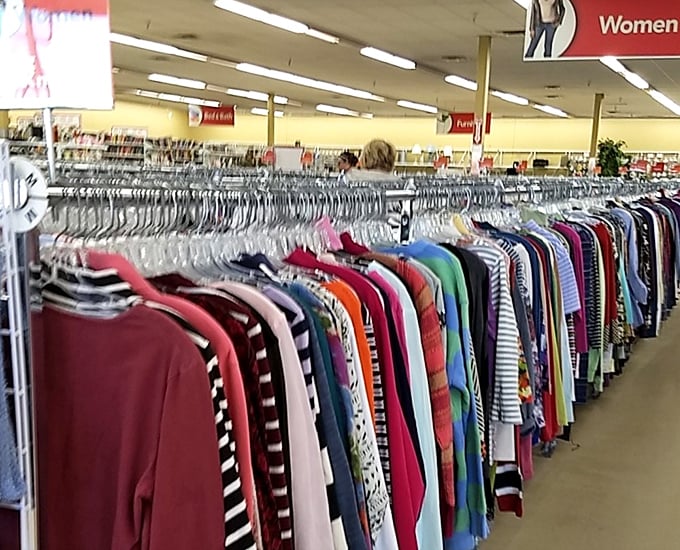 Rainbow rivers of fabric flow through the women's section. Each garment holds a story, waiting for you to write its next chapter.