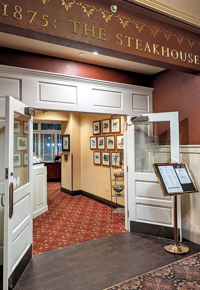 "1875: The Steakhouse" announces itself with golden elegance. Step through these doors and enter a world where steak is treated with proper reverence.