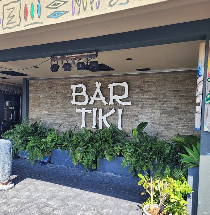 Bar Tiki's bold brick-and-fern entrance isn't just a sign&mdash;it's an invitation to escape the ordinary into a tropical state of mind.