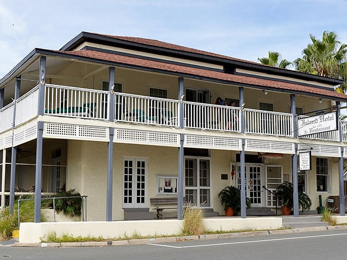 The Island Hotel stands like a gracious Southern belle, offering front-porch hospitality that money simply can't manufacture.