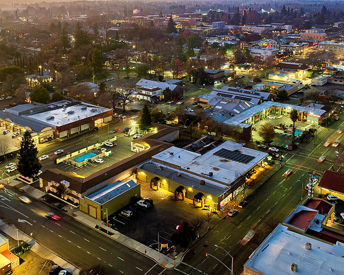 Chico's downtown glows at sunset, transforming ordinary buildings into a golden-hour light show worth every penny of your reasonable rent.