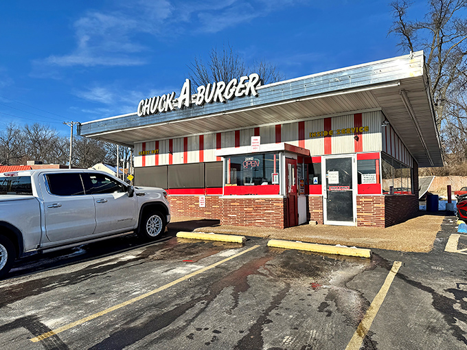 Chuck-A-Burger's red and white striped facade is like a time machine to the 1950s, complete with juicy burgers and nostalgic vibes.