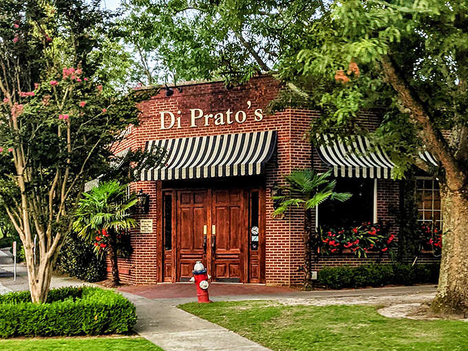 DiPrato's brick building with classic striped awnings looks like it was plucked straight from a Nora Ephron film. 