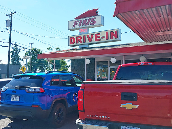 Fins Drive-In's vintage sign promises what every road trip needs&mdash;a burger joint where Elvis would feel right at home.
