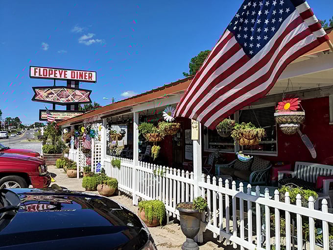 Flopeye Diner waves the stars and stripes proudly alongside hanging plants and a white picket fence &ndash; Norman Rockwell would approve!