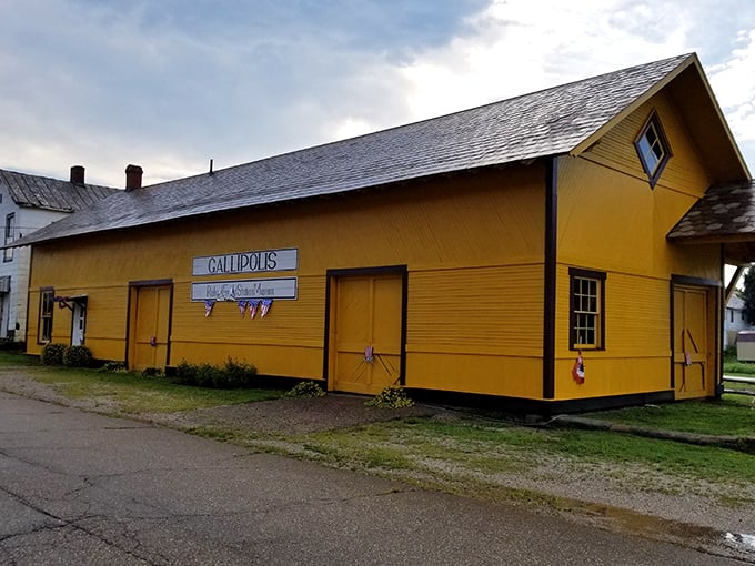 The bright yellow Gallipolis train depot pops against the blue Ohio sky, a cheerful landmark in this historic French-founded town.