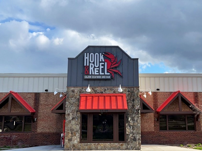 Hook & Reel's bold sign and stone facade set the stage for Cajun seafood drama. Prepare for a spicy performance on your plate!