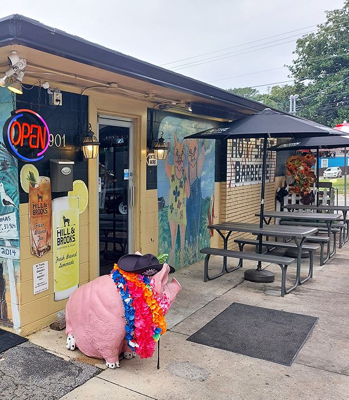 That festive pig mascot wearing Hawaiian leis knows how to party - and apparently how to smoke meat too.