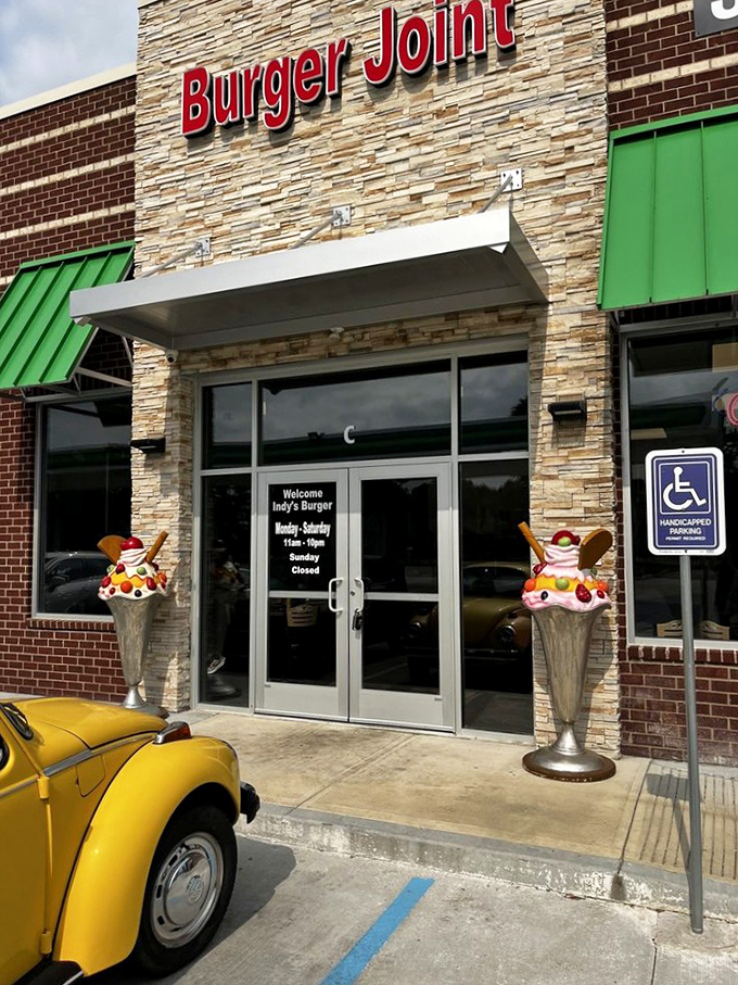 Indy's Burger Joint in Brownsburg welcomes hungry visitors with stone facade charm. Those ice cream sundae decorations hint at sweet treats beyond burgers.