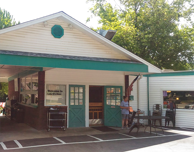 Lady Di's charming cottage-like exterior with teal accents feels like the summer home your breakfast always wanted.