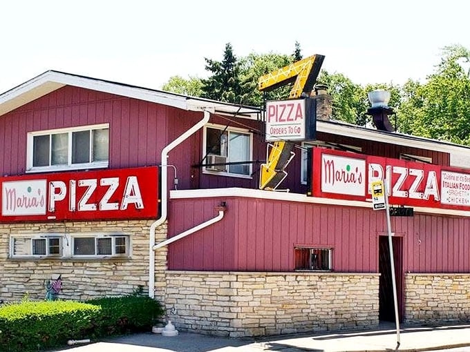 Maria's Pizza's unmistakable pink building stands out like a delicious landmark. That vintage neon sign has guided hungry Milwaukeeans for generations.