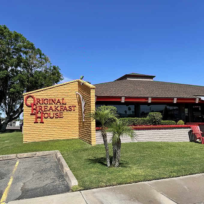 Original Breakfast House's sunny exterior and palm trees create the perfect Arizona morning backdrop for pancakes that defy gravity.