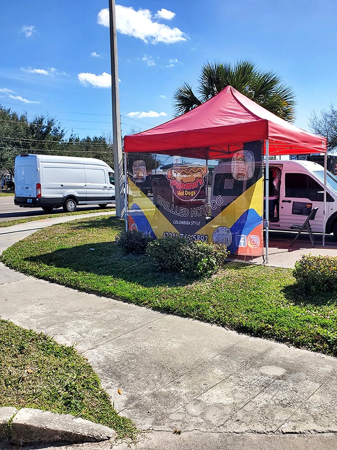 Street food meets gourmet dreams under this cheerful tent - Colombian hot dogs are having their moment.