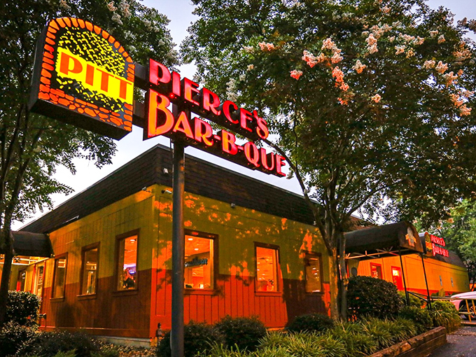 Pierce's neon sign glows like a barbecue beacon in the night. It's been guiding hungry travelers for generations.
