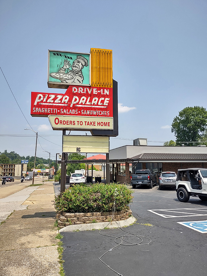 Pizza Palace's retro sign is a portal to simpler times. When "drive-in" meant service with a smile and pizza that didn't need fancy names.