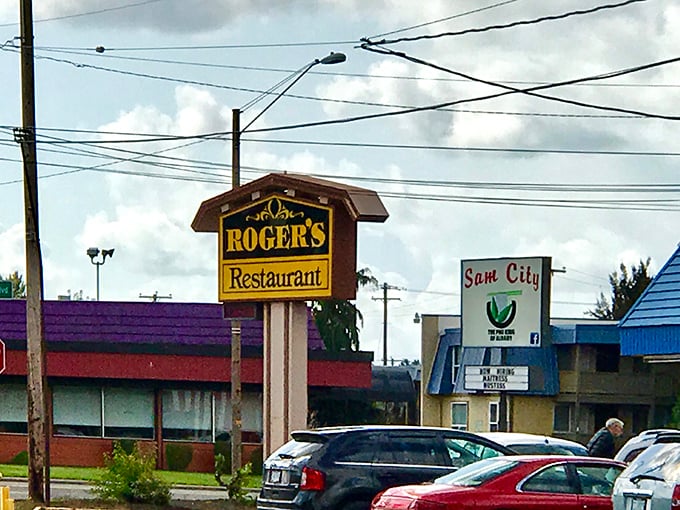Roger's Restaurant sign stands tall against Oregon skies, a beacon of breakfast hope in Albany.