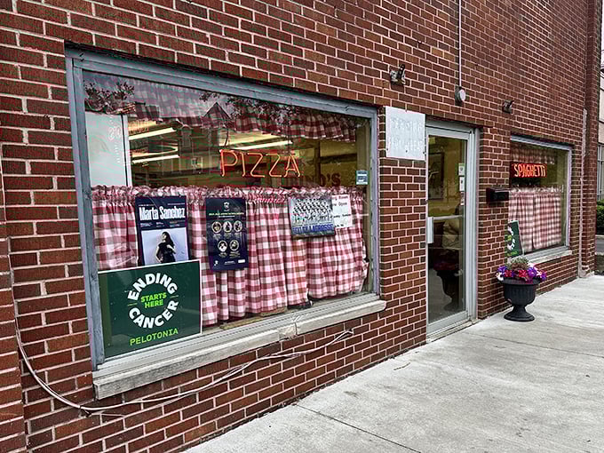 Rubino's Pizza: That classic red-checkered curtain is the universal signal for "authentic Italian food awaits inside."