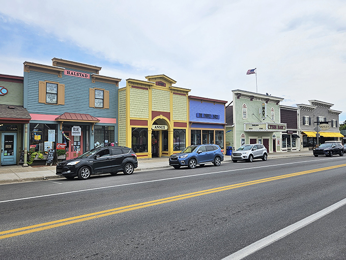 Suttons Bay: Colorful storefronts pop against Michigan blue skies. The kind of main street where shopkeepers actually remember your name!