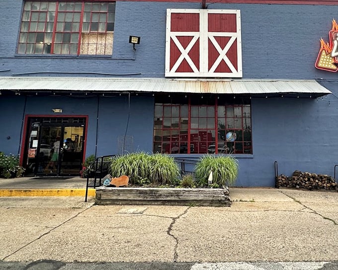 Behind those barn doors lies a world where smoke and time transform ordinary meat into extraordinary memories.
