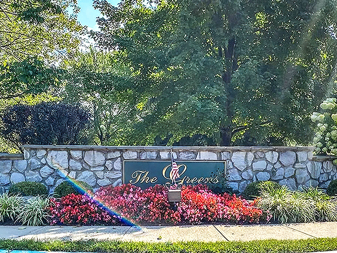 Stone elegance announces "The Greens" like a country club entrance, minus the intimidating membership fees.