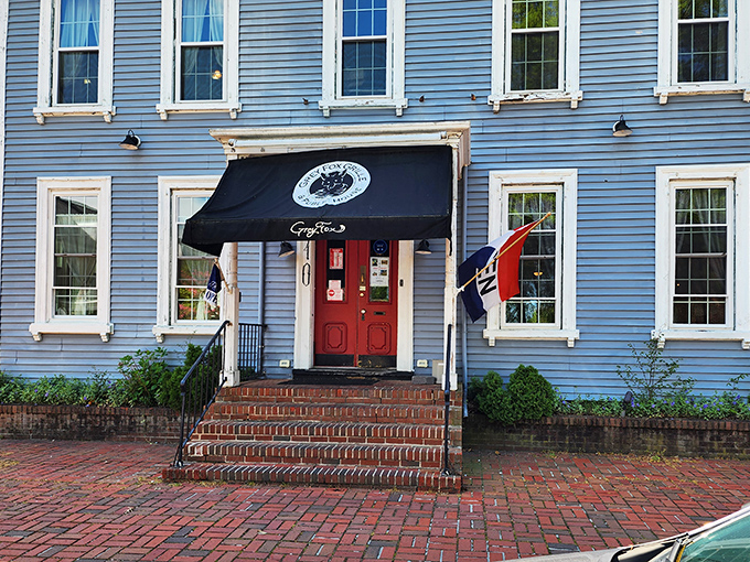 The Grey Fox Grille's historic blue building stands like a delicious time capsule in downtown Dover. Classic charm, modern flavors!