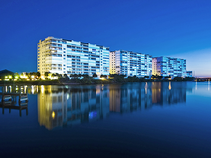 Titusville's waterfront condos light up the evening sky, reflecting in the lagoon like a retirement light show.