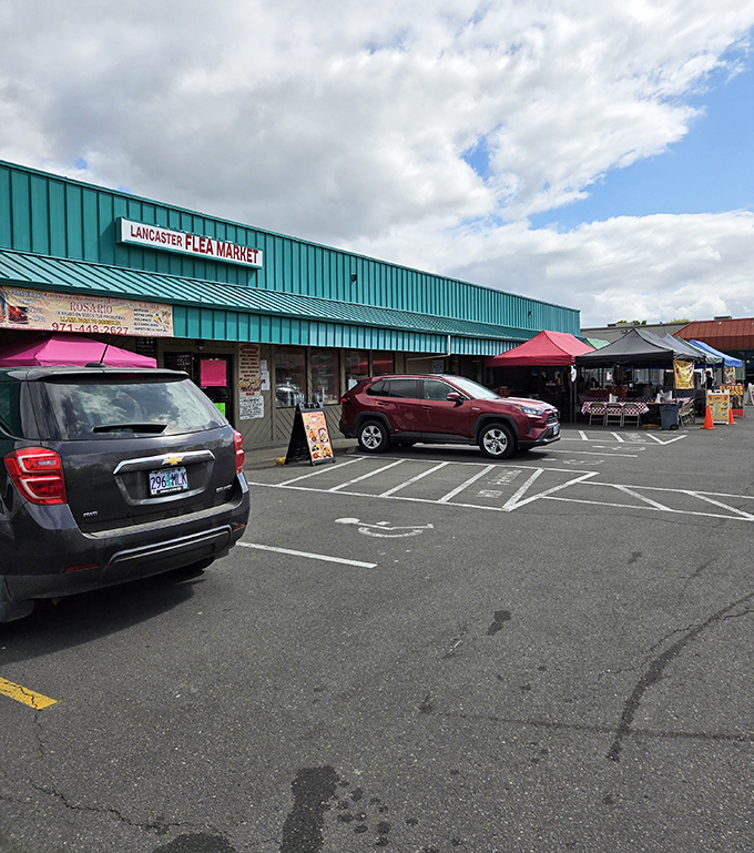Lancaster Flea Market's teal-green roof shelters a world of weekend treasures. Even the parking lot transforms into a bargain hunter's playground!