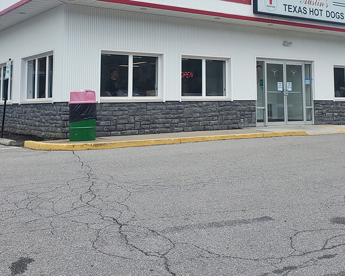 The unassuming exterior of Austin's hides a hot dog paradise within – where generations have discovered the perfect snap of a quality frank.