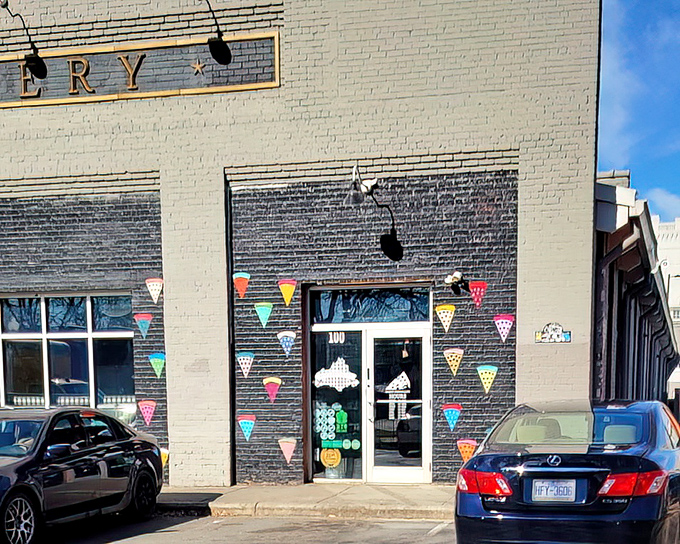 The lattice fence can't contain the delicious aromas wafting from those giant, New York-style slices inside.