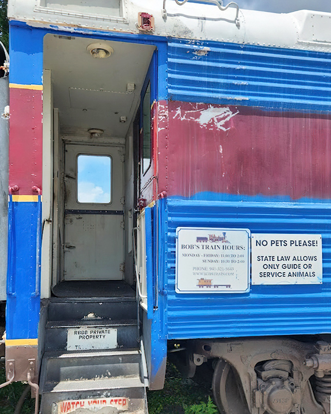 The blue and red exterior of Bob's Train hints at the unique dining experience waiting inside these restored railroad cars.