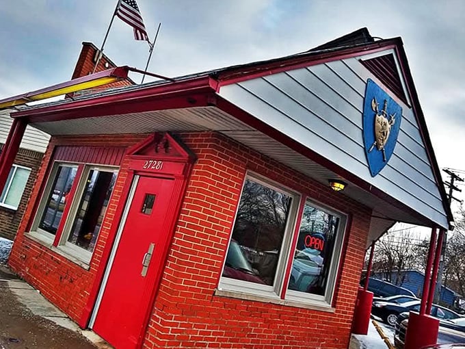 Canterbury's bold red door and medieval shield sign are like a coat of arms declaring "Serious Breakfast Served Here!"