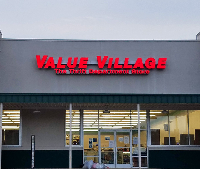 The bright red Value Village sign stands out like a bargain-hunter's North Star, guiding smart shoppers to unexpected treasures.