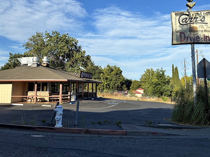 That weathered sign and country setting whisper promises of honest food made with genuine care.