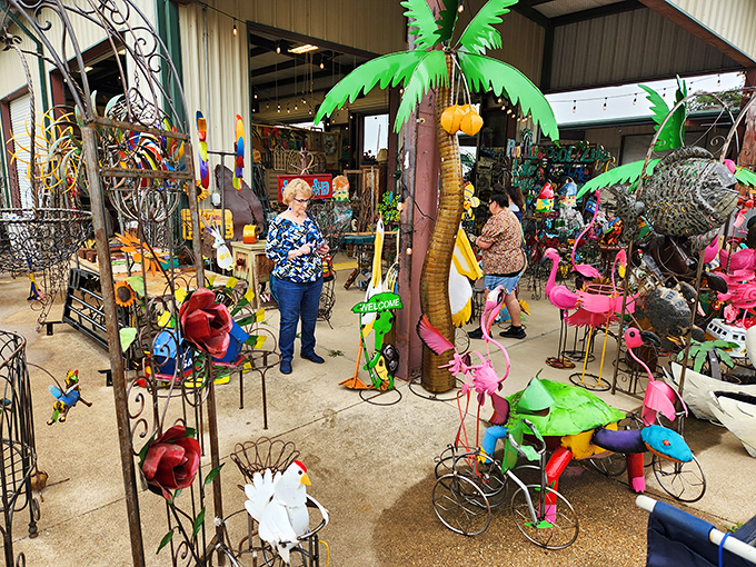 Colorful garden decorations and whimsical treasures—where else can you find a metal palm tree next to pink flamingos?