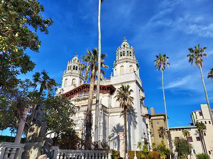 Hearst Castle: Twin white towers reach for the blue sky, surrounded by palm trees&mdash;where Spanish architecture meets Hollywood glamour in spectacular fashion.