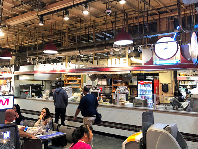 The organized chaos of Reading Terminal Market frames Hershel's perfectly&mdash;a deli counter where sandwich artistry happens in plain sight.