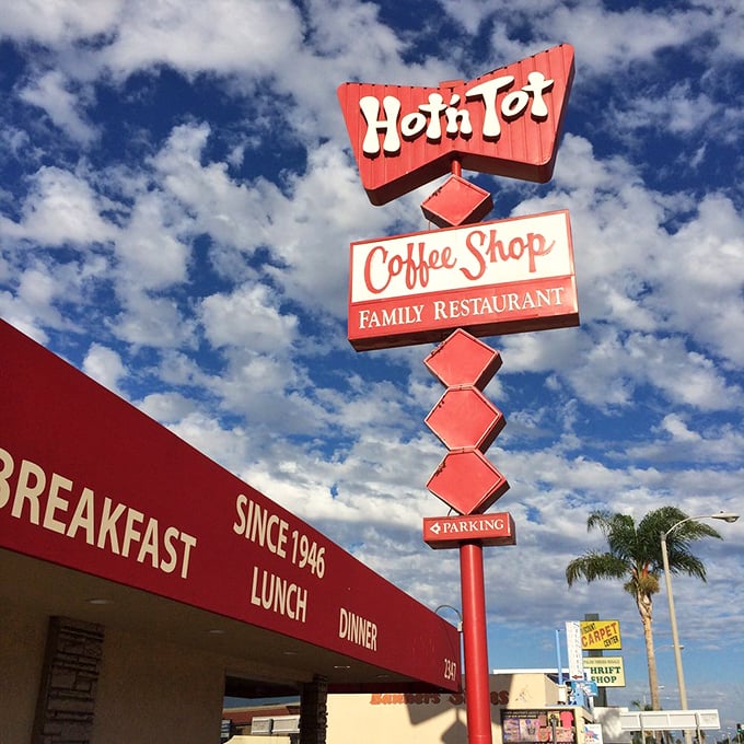 Hot N Tot: The neon sign beckons like an old friend. Inside, omelets defy gravity and the coffee keeps flowing like the conversations at the counter. 