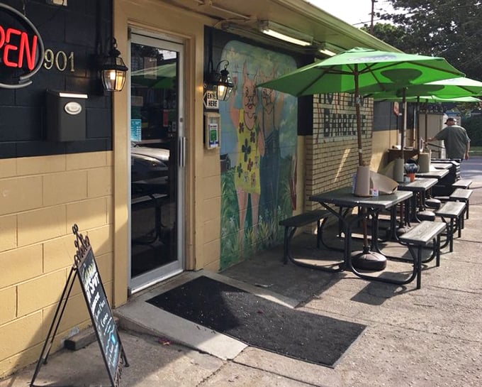 Outdoor seating at Hot Spot Barbecue invites you to enjoy your meal al fresco. Green umbrellas provide shade while you dive into smoky goodness.