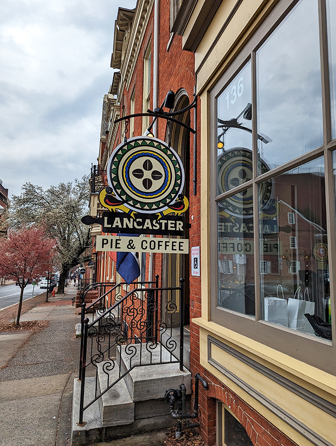 That cheerful yellow sign isn’t just decor—it’s the marquee for Lancaster’s most delicious street theater.